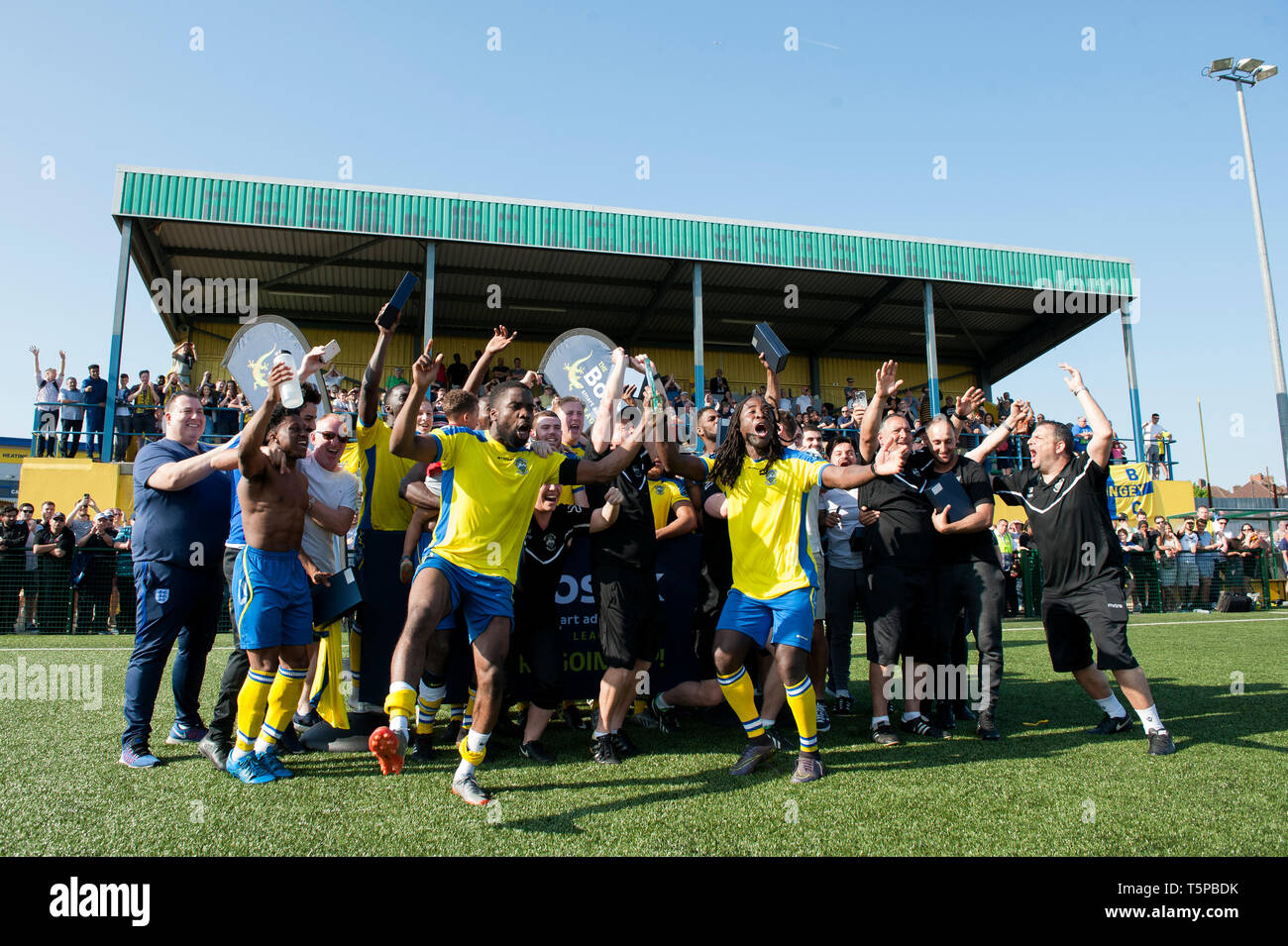 The Haringey Borough players celebrate earning promotion after winning ...