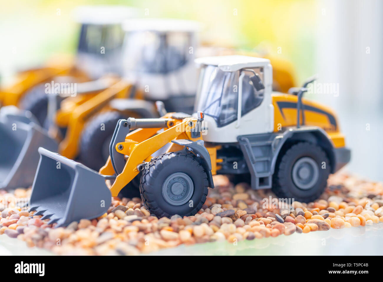A model wheel loader stands in a glass cabinet Stock Photo - Alamy