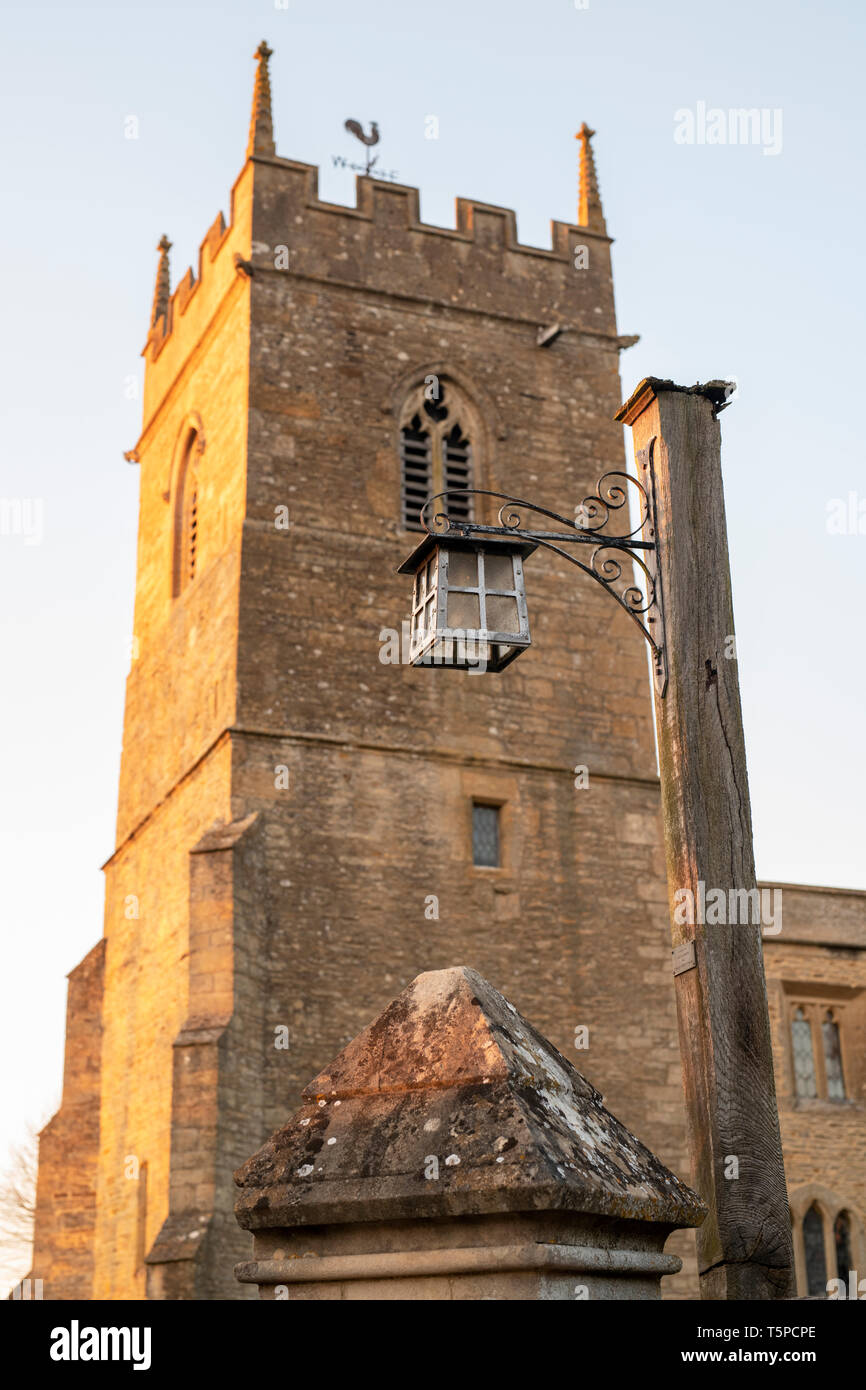 Old fashioned lamp outside Saint John the baptist church in Cherington ...