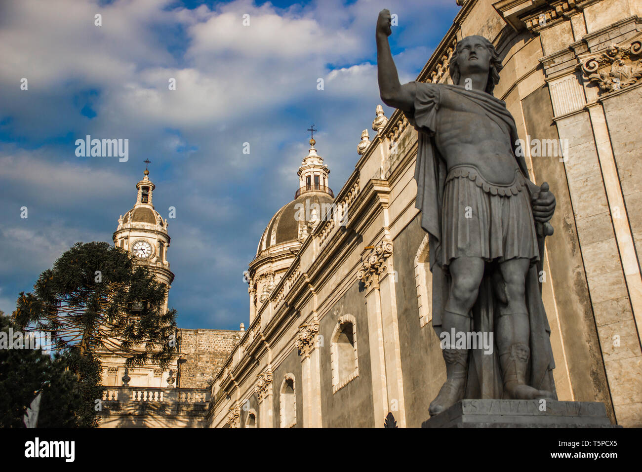 Catania cathedral detail, baroque architecture with dome, statue and ...