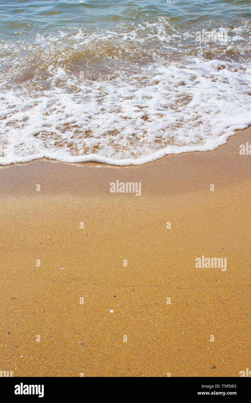 Soft wave of the sea on the sandy beach Stock Photo - Alamy