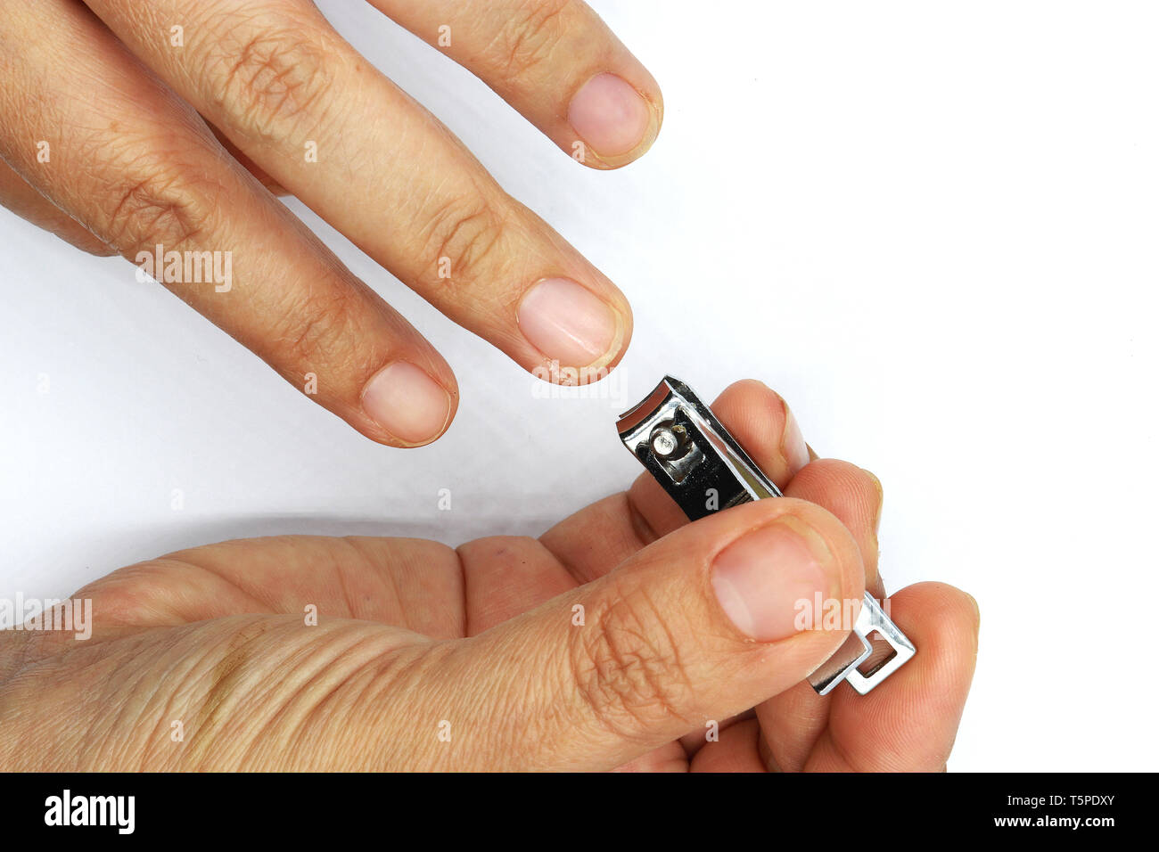 Closeup hand using nail clipper hi-res stock photography and images - Alamy