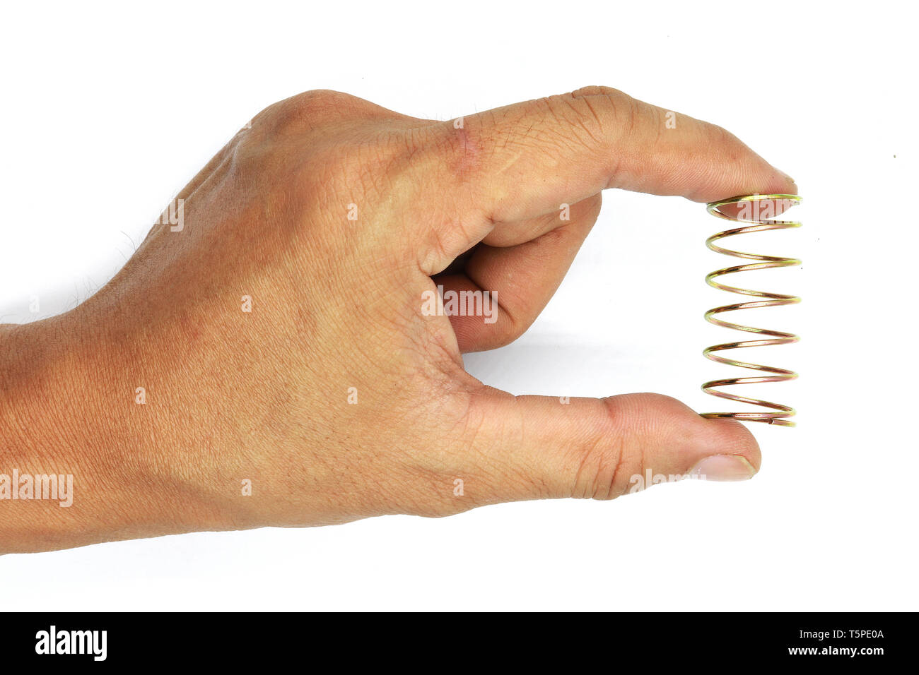 Man's hand holding chrome spring isolated on white background Stock ...