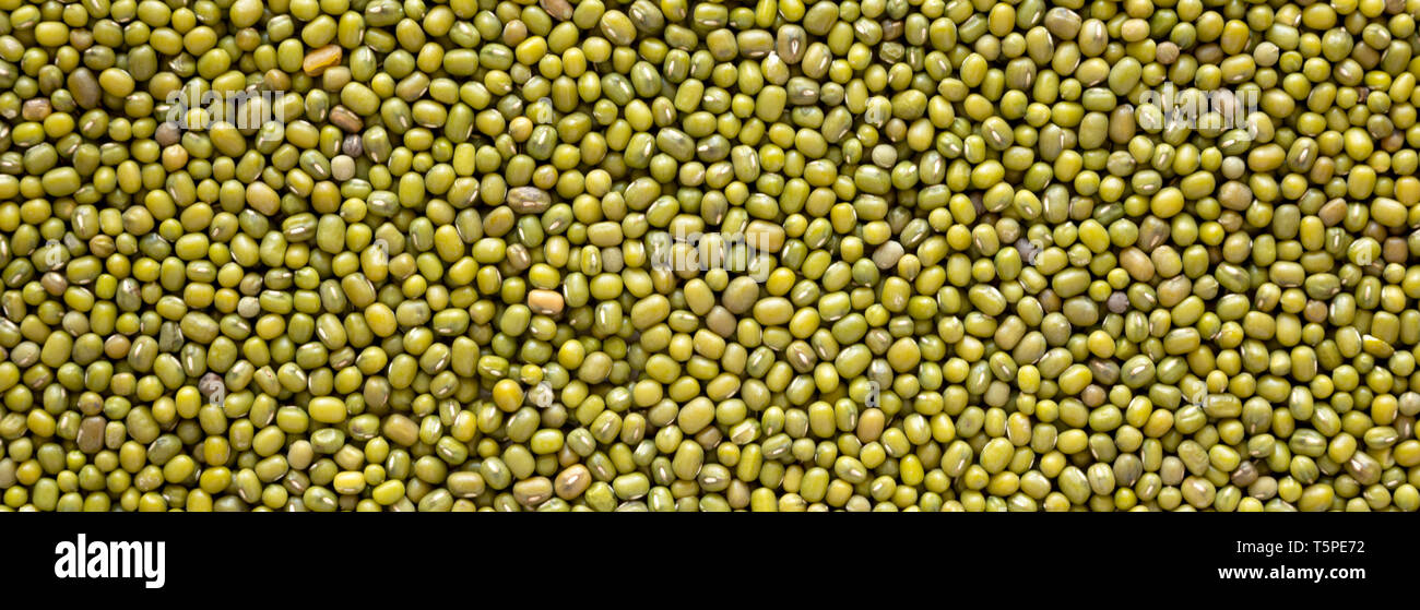 Raw green mung beans background, top view Stock Photo - Alamy