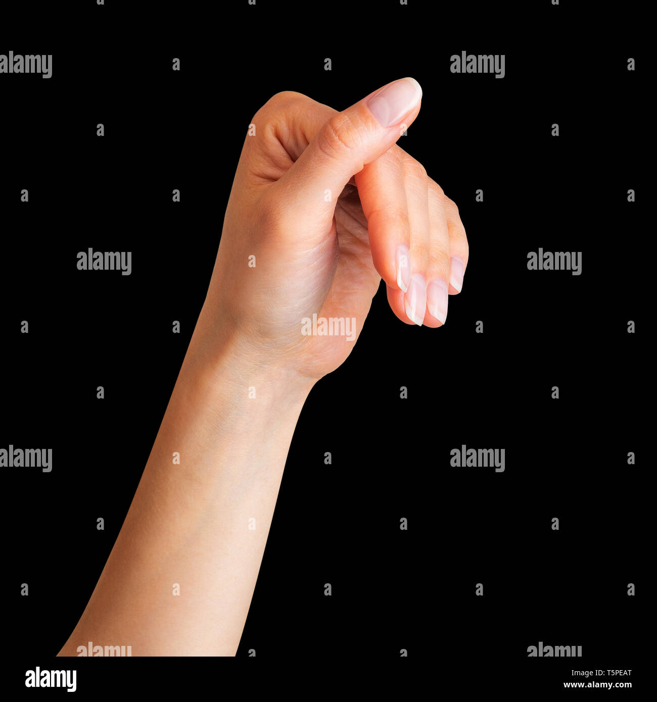 Woman hand clinging on some wall edge on black background. Isolated ...