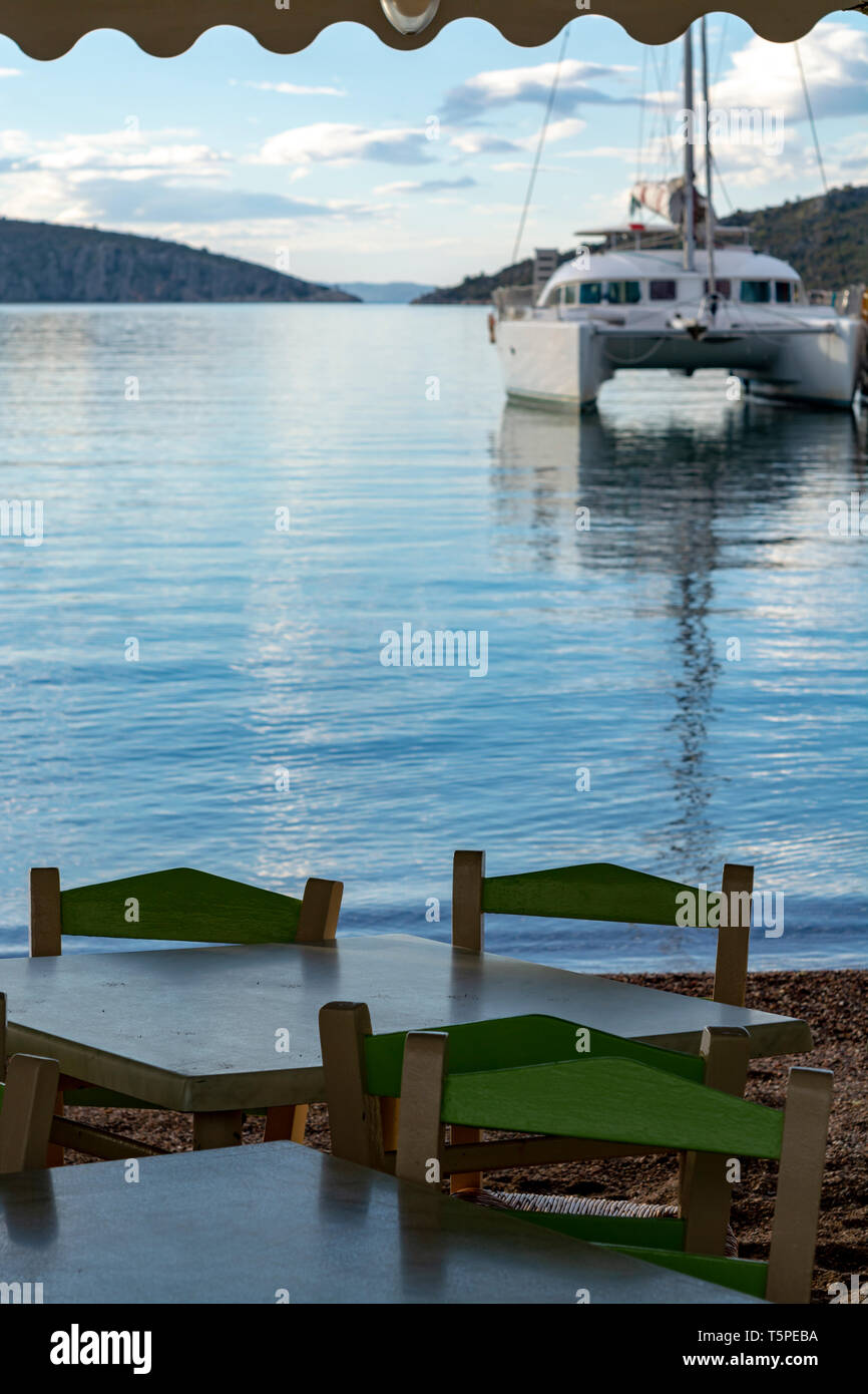 Seascape with cozy sea bay and big white catamaran yacht boat, vacation ...