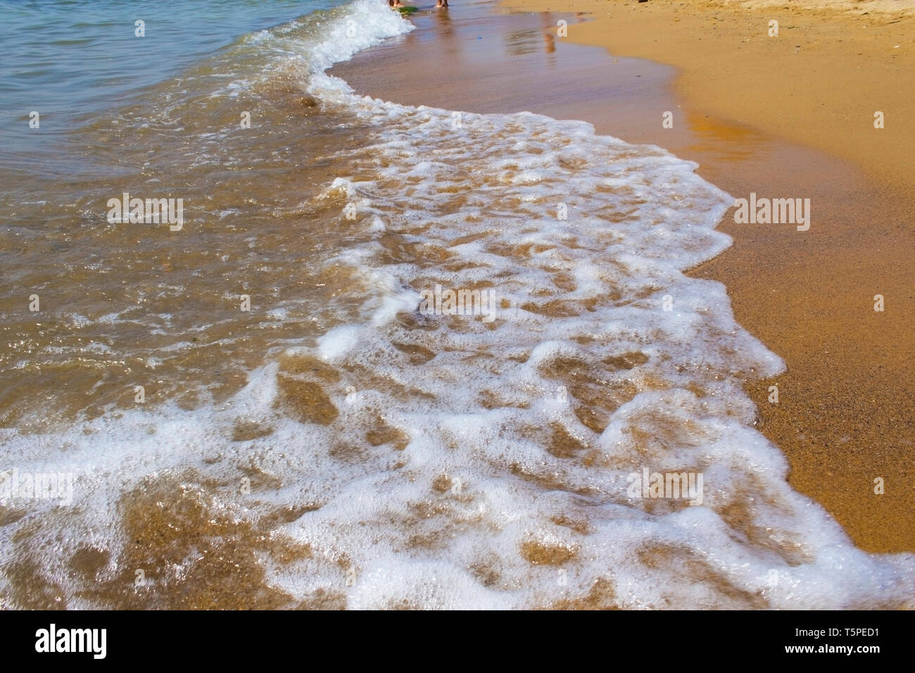 Soft wave of the sea on the sandy beach Stock Photo - Alamy