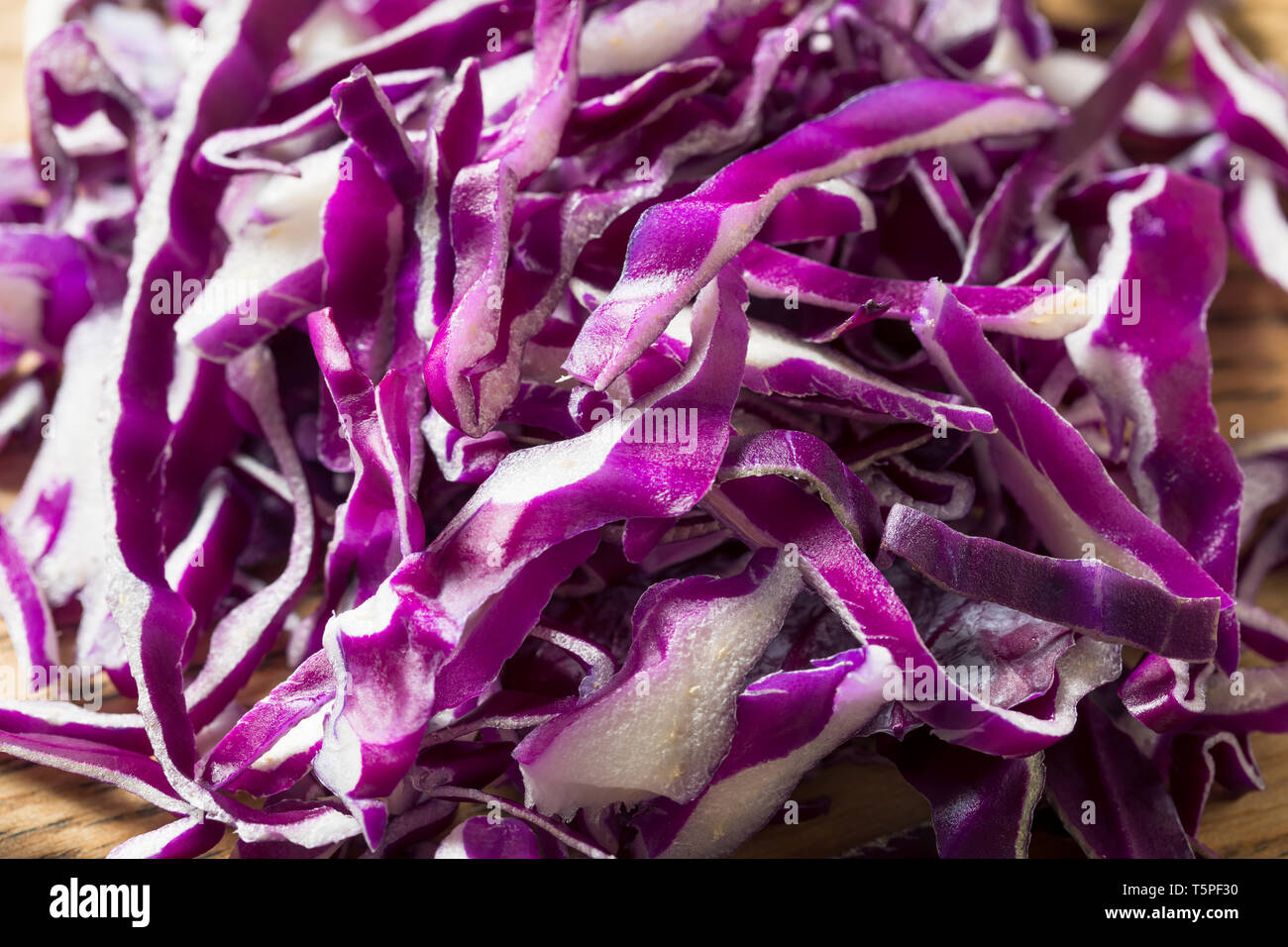 Raw Shredded Purple Cabbage on a Cutting Board Stock Photo - Alamy