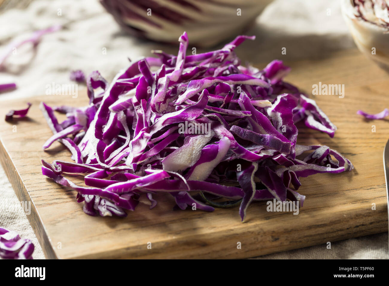 Raw Shredded Purple Cabbage on a Cutting Board Stock Photo - Alamy