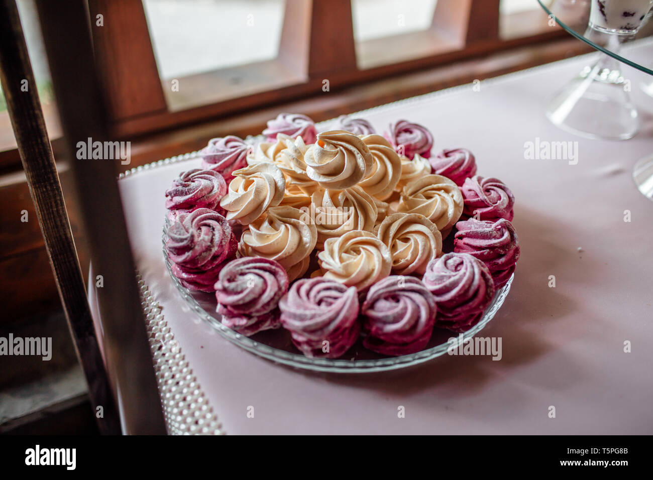 Colorful pastel marshmallow zephyr on white plate and white background ...