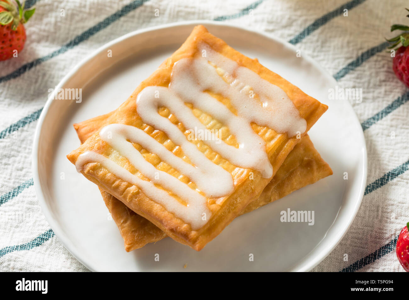 Sweet Breakfast Strawberry Toaster Pastry with Frosting Stock Photo - Alamy