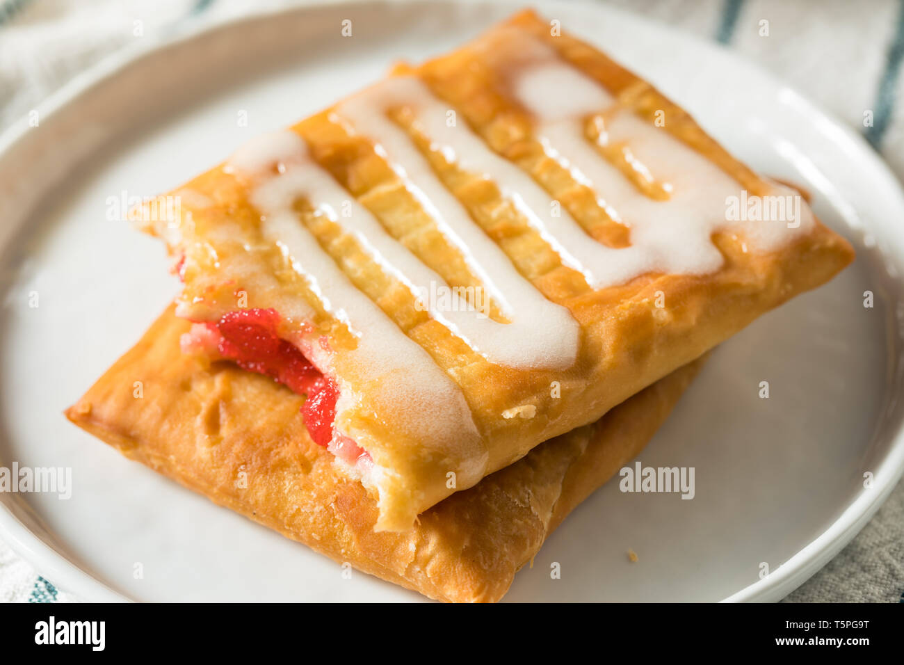 Sweet Breakfast Strawberry Toaster Pastry with Frosting Stock Photo - Alamy