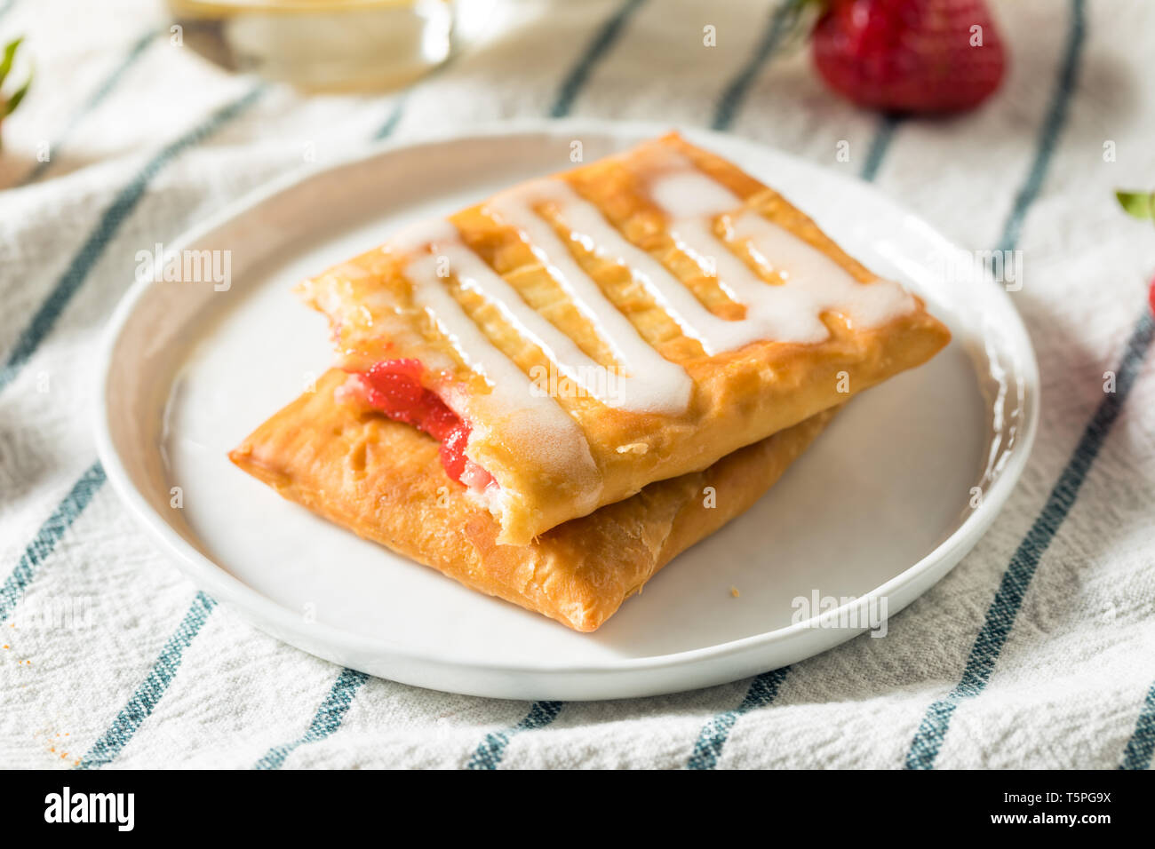 Sweet Breakfast Strawberry Toaster Pastry with Frosting Stock Photo - Alamy