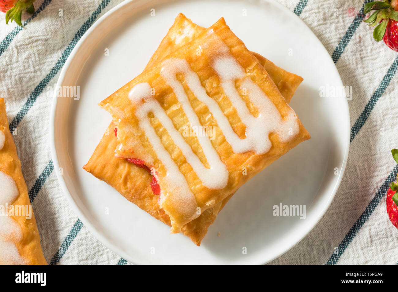 Sweet Breakfast Strawberry Toaster Pastry with Frosting Stock Photo - Alamy
