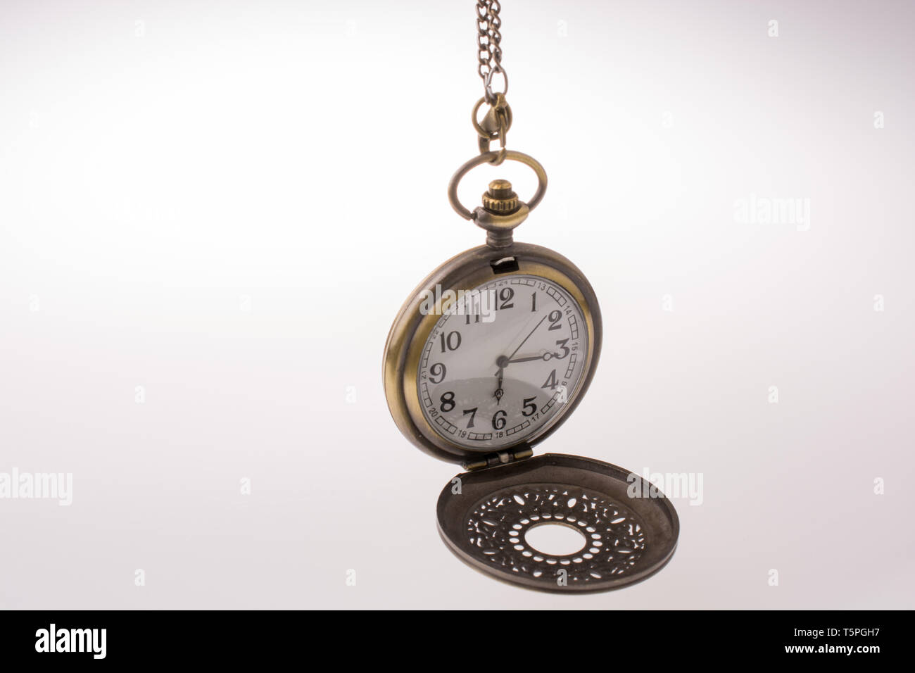 Retro style pocket watch on white background Stock Photo - Alamy