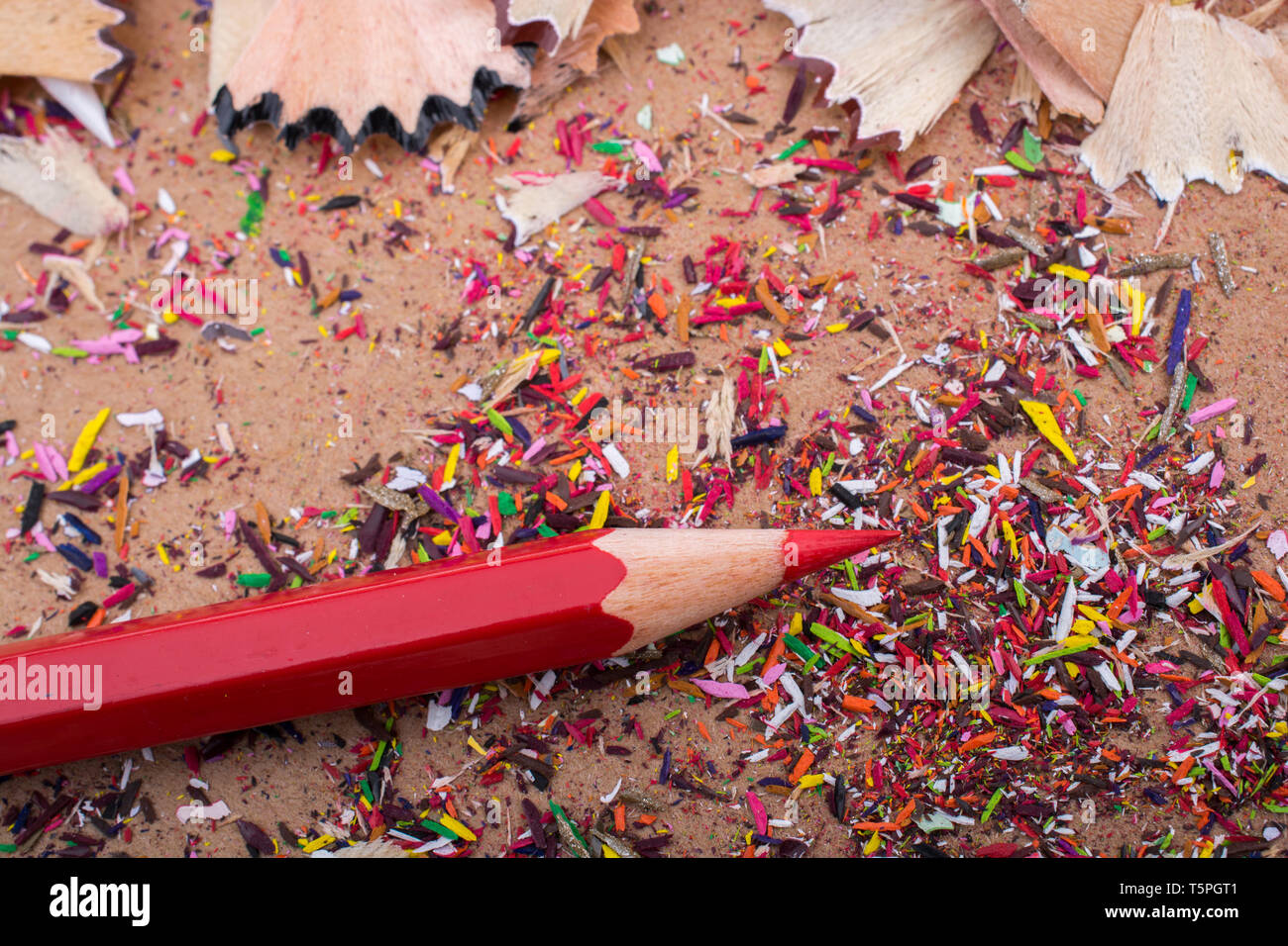 Red Color Pencil over some pencil shavings Stock Photo - Alamy