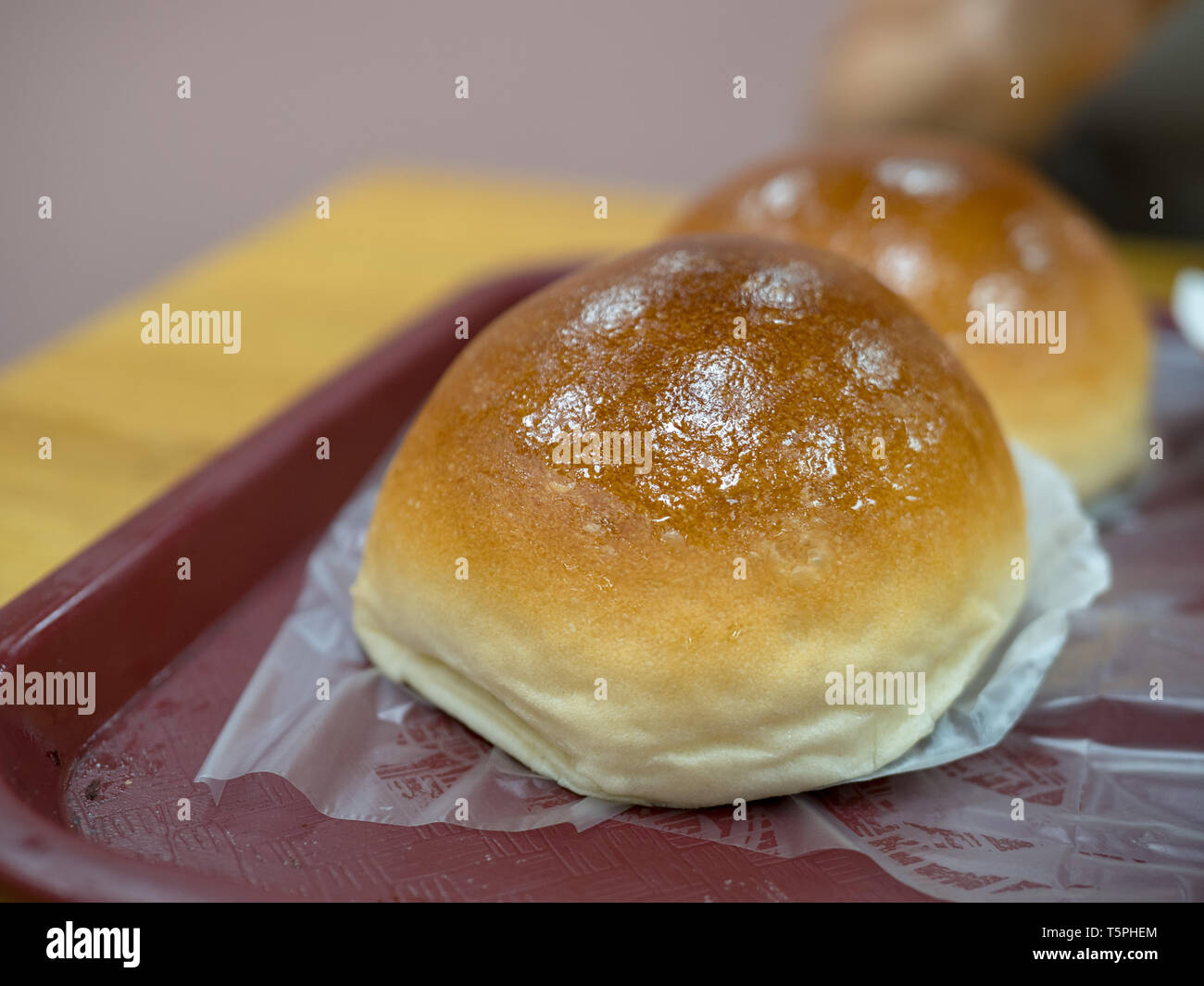 Baked pork bun on tray at small dim sum dining eatery Stock Photo - Alamy