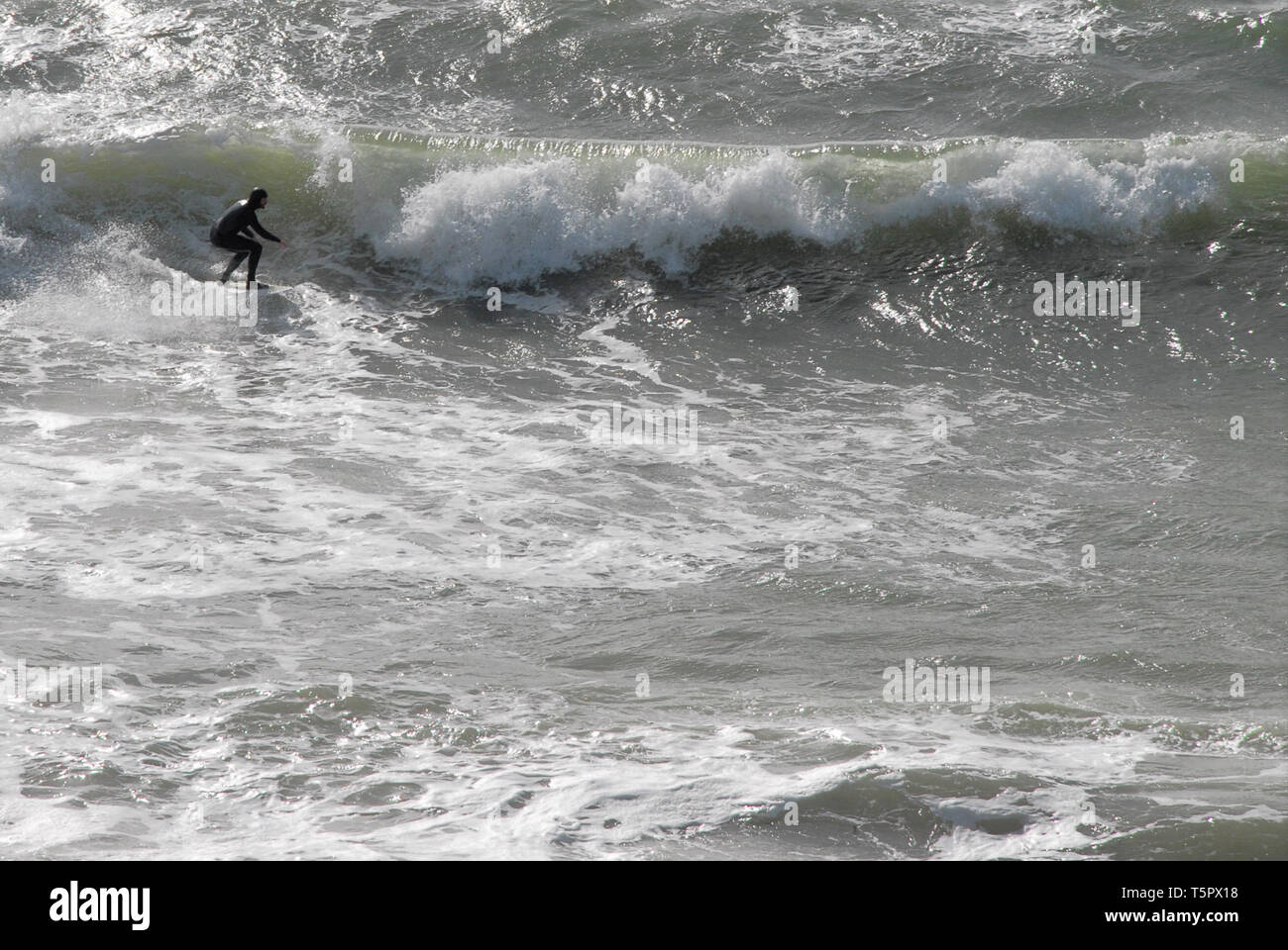 Chesil beach. 26th April 2019. Surfers enjoy the waves on Chesil Beach ...