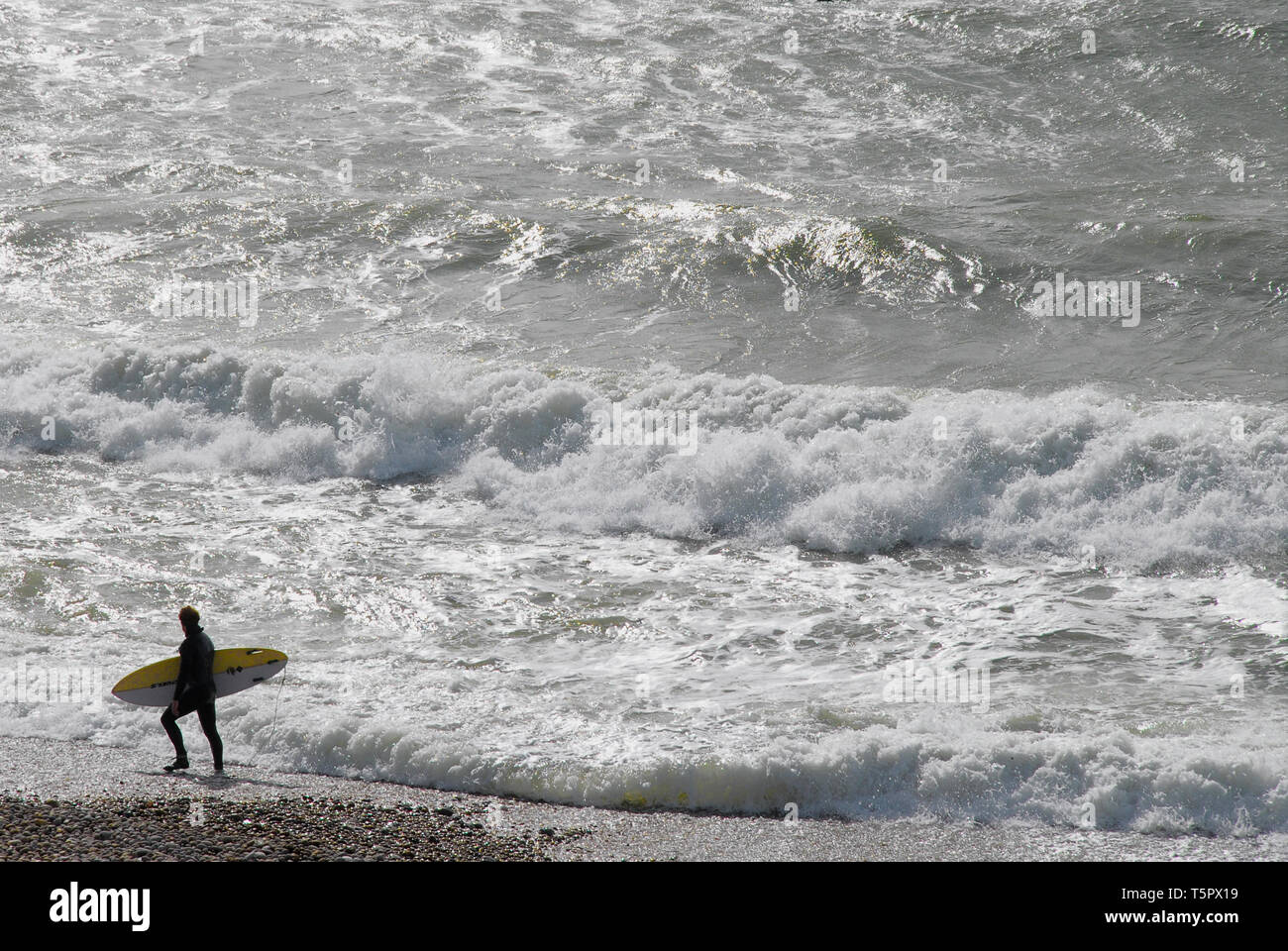 Chesil beach. 26th April 2019. Surfers enjoy the waves on Chesil Beach ...