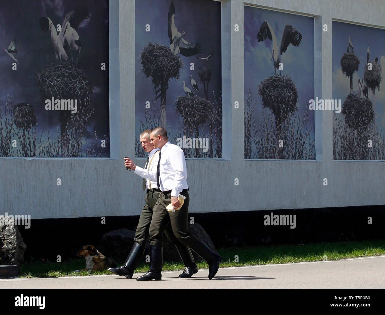 Two men are seen walking next to images of a local museum dedicated to ...