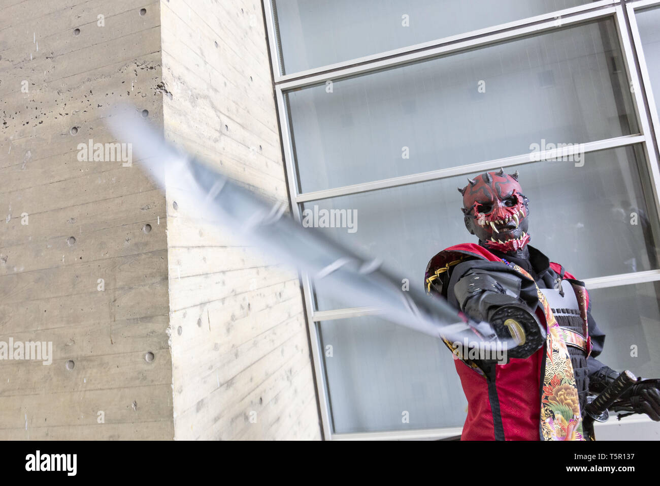 Chiba, Japan. 27th Apr, 2019. A cosplayer poses for a photograph during ...