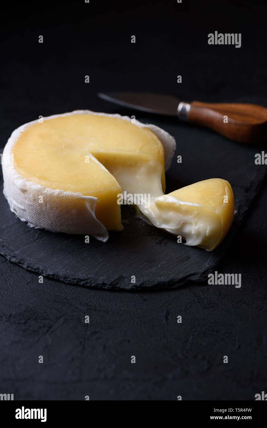 Butter soft creamy sheep cheese from Seia region Portugal on black ...