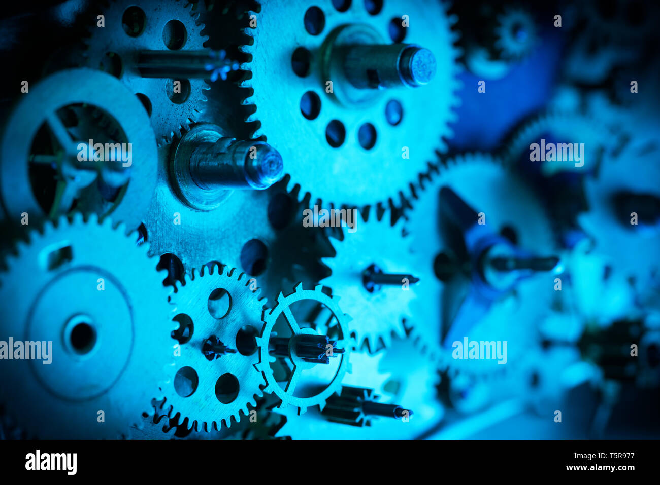 Cogs and gears blue toned Stock Photo - Alamy