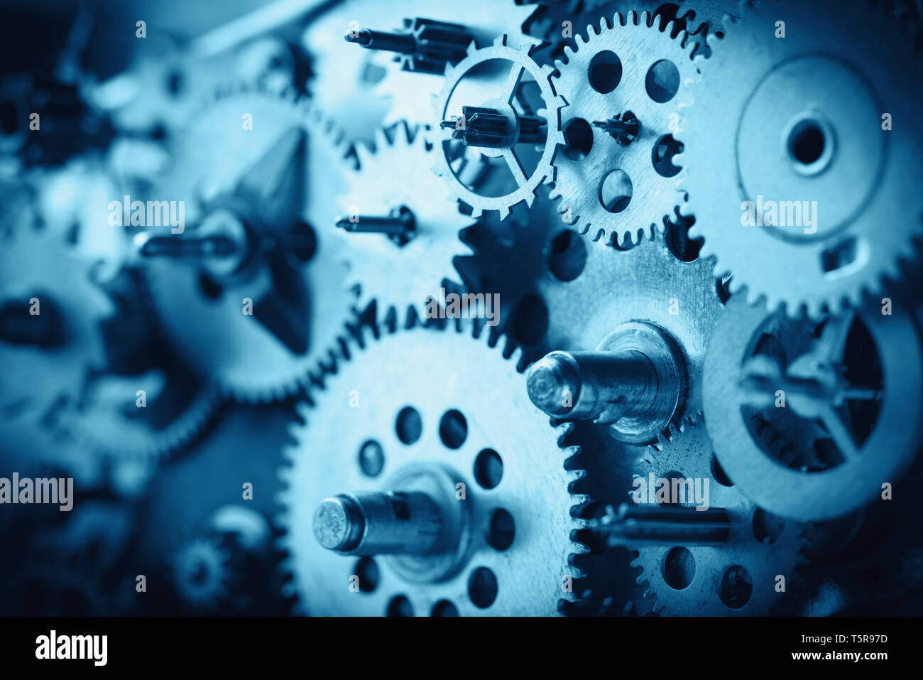 Vintage gears and cogs macro blue color toned Stock Photo - Alamy