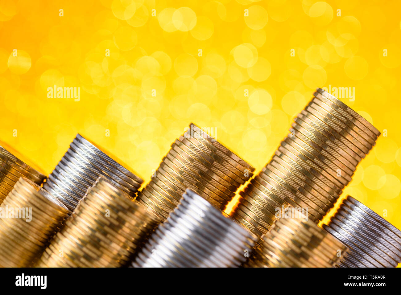 Stacked coins closeup Stock Photo - Alamy