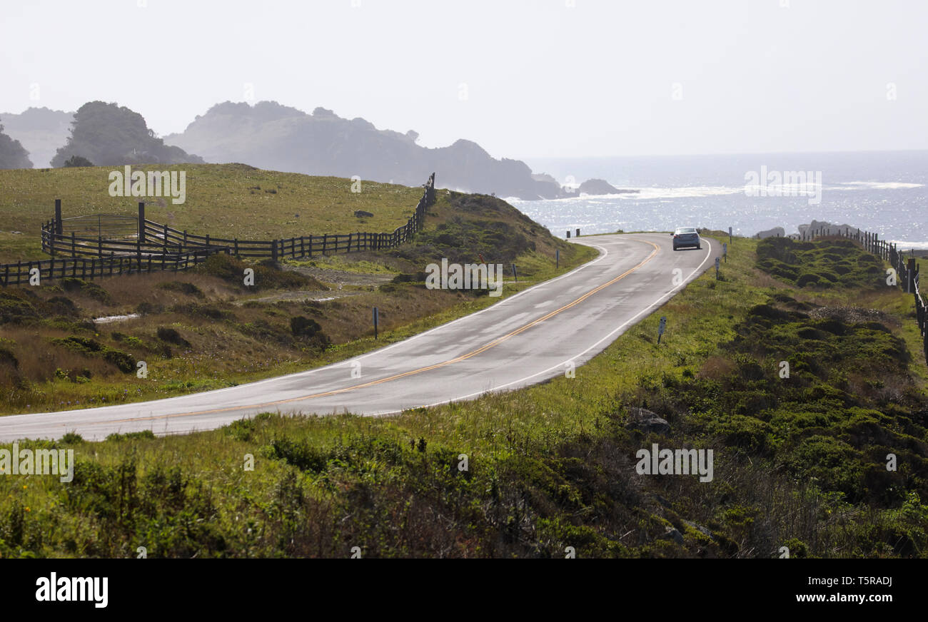 A car navigates California's State Route 1, also known as Coast Highway ...