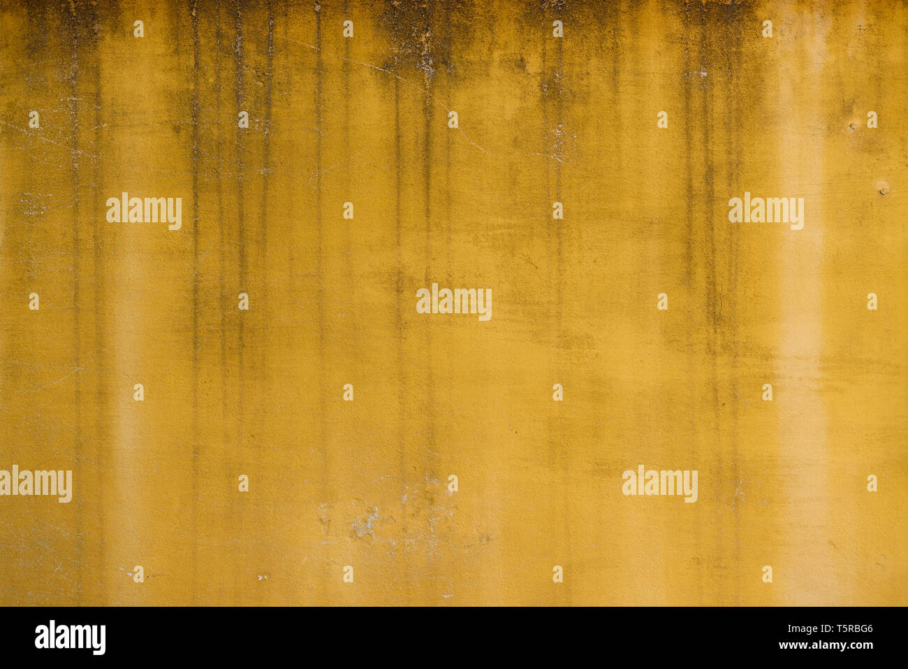 Old weathered yellow painted stucco wall texture Stock Photo - Alamy