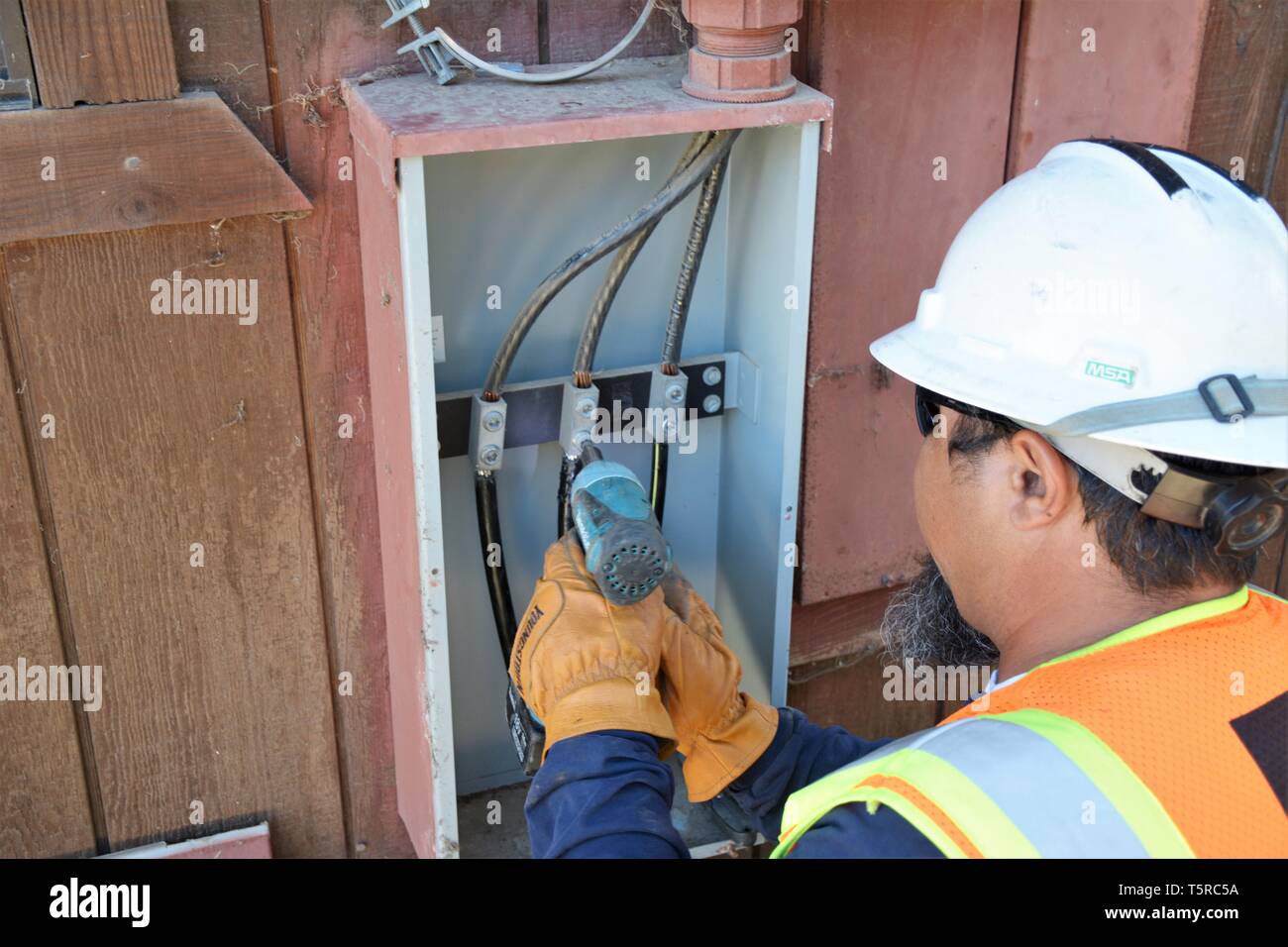 Repairs being done to faulty wiring in older home by trained and ...