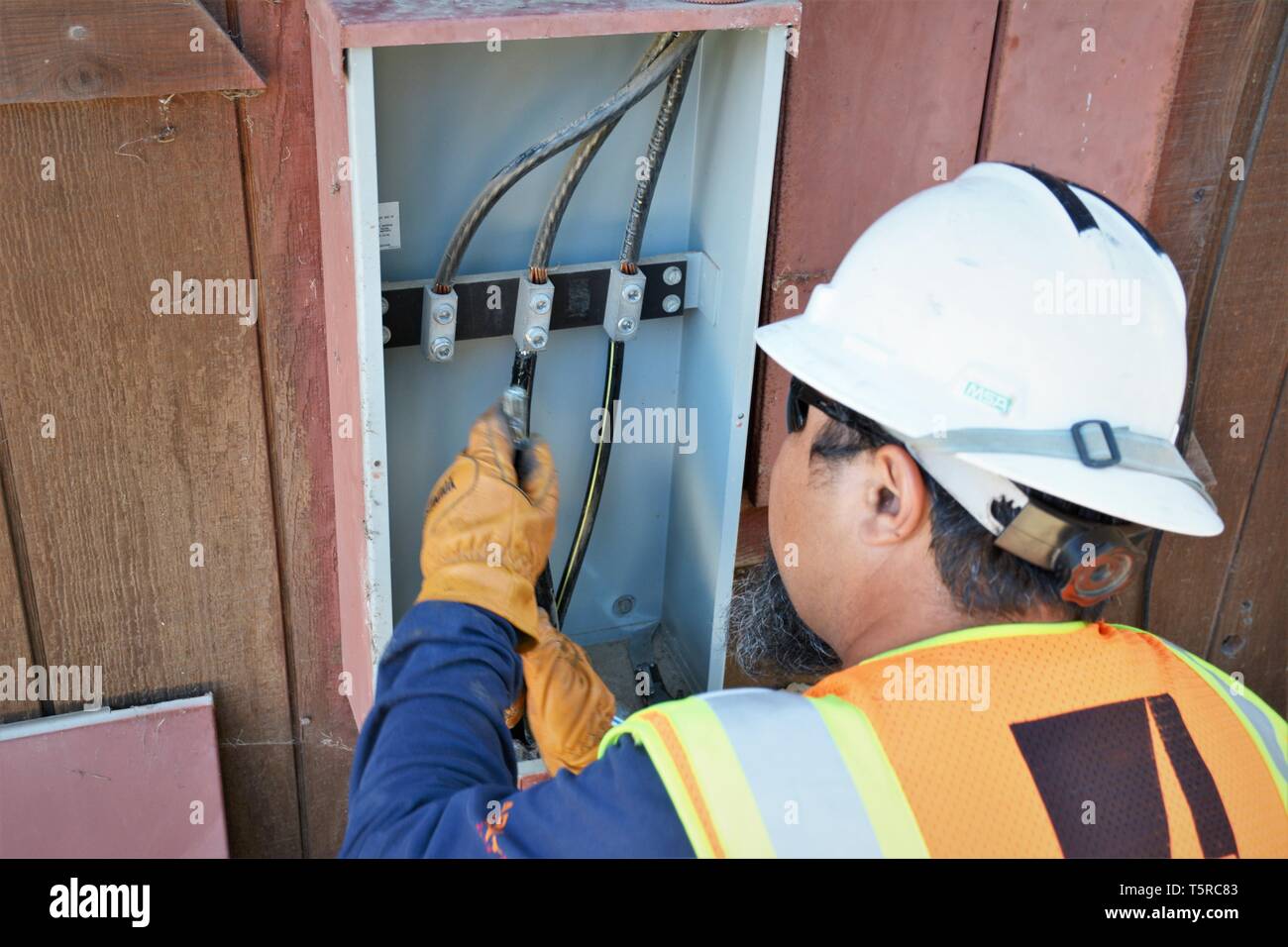 Repairs being done to faulty wiring in older home by trained and ...