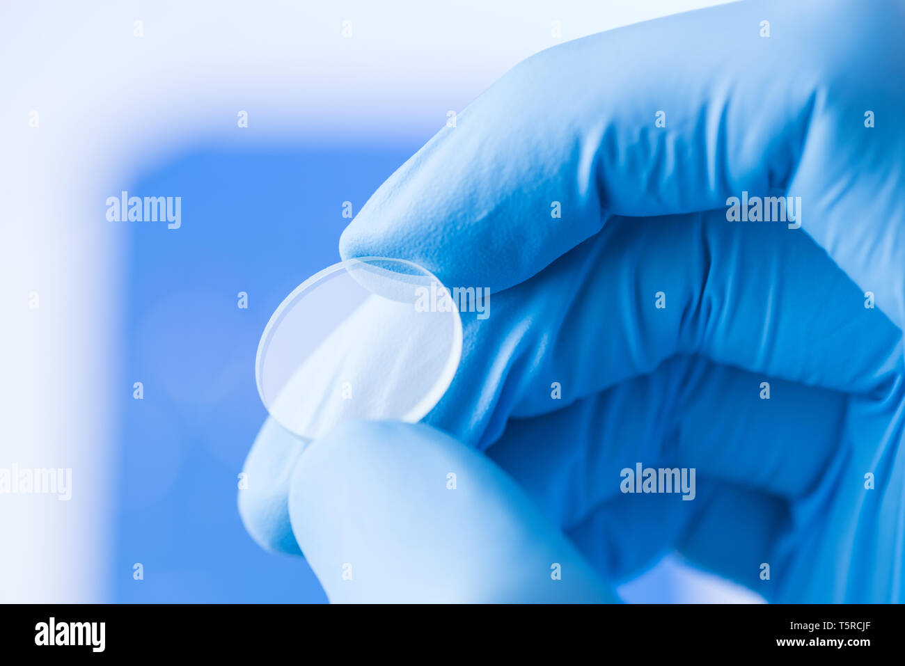 Round piece of transparent plastic, new type of glass or plastic with ...