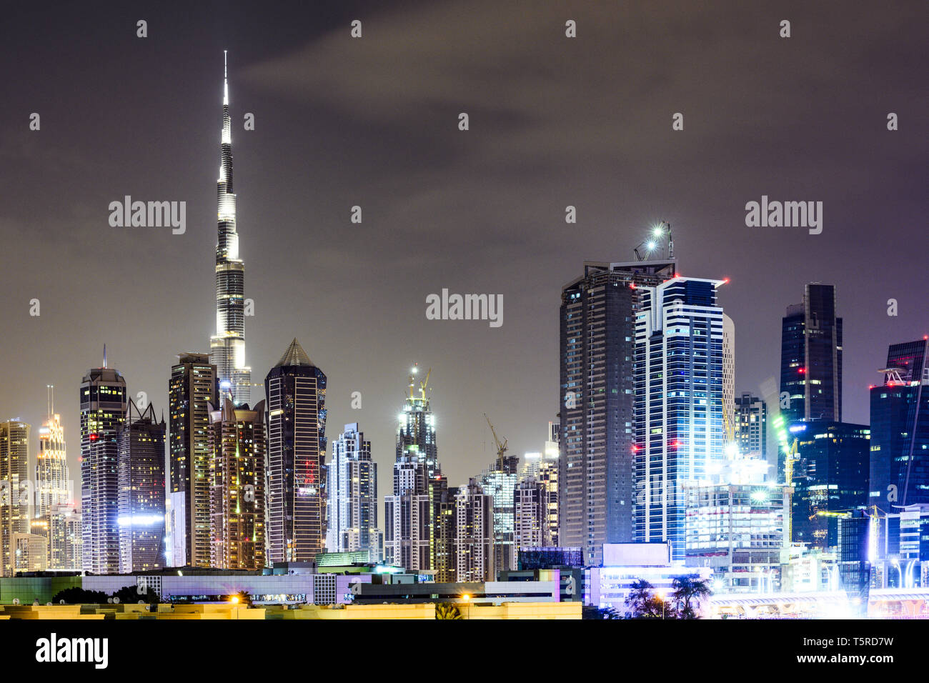 Stunning view of the illuminated Dubai skyline during sunset with ...