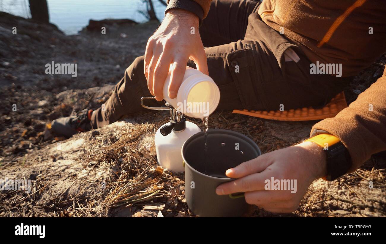 Man pours boiling water from hi-res stock photography and images - Alamy
