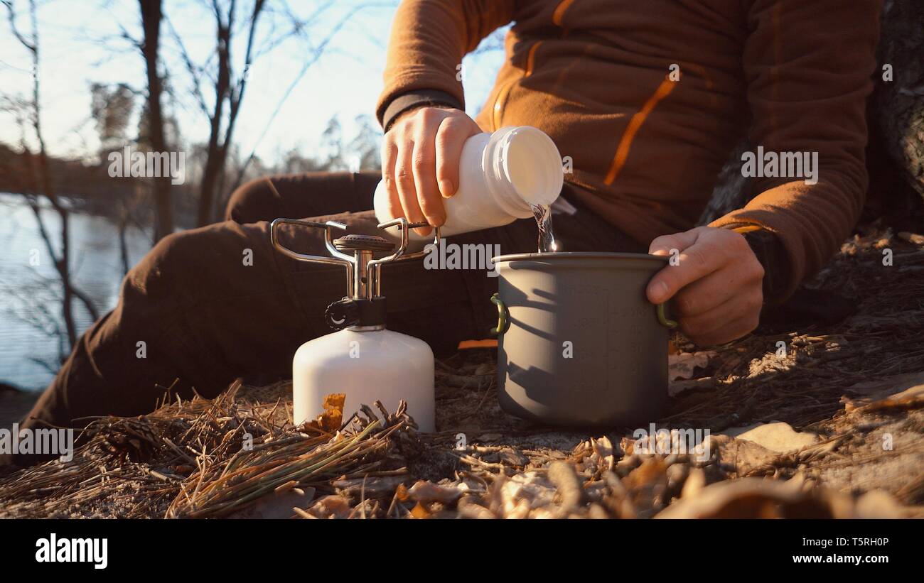 Man pours boiling water from hi-res stock photography and images - Alamy