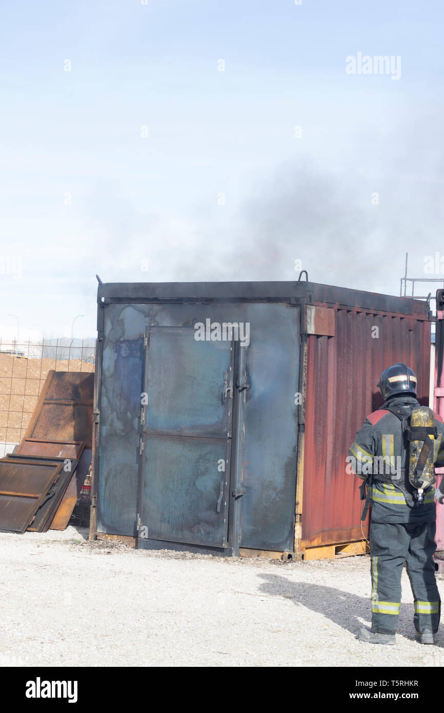 Firefighter putting out fire training station extinguisher backdraft ...