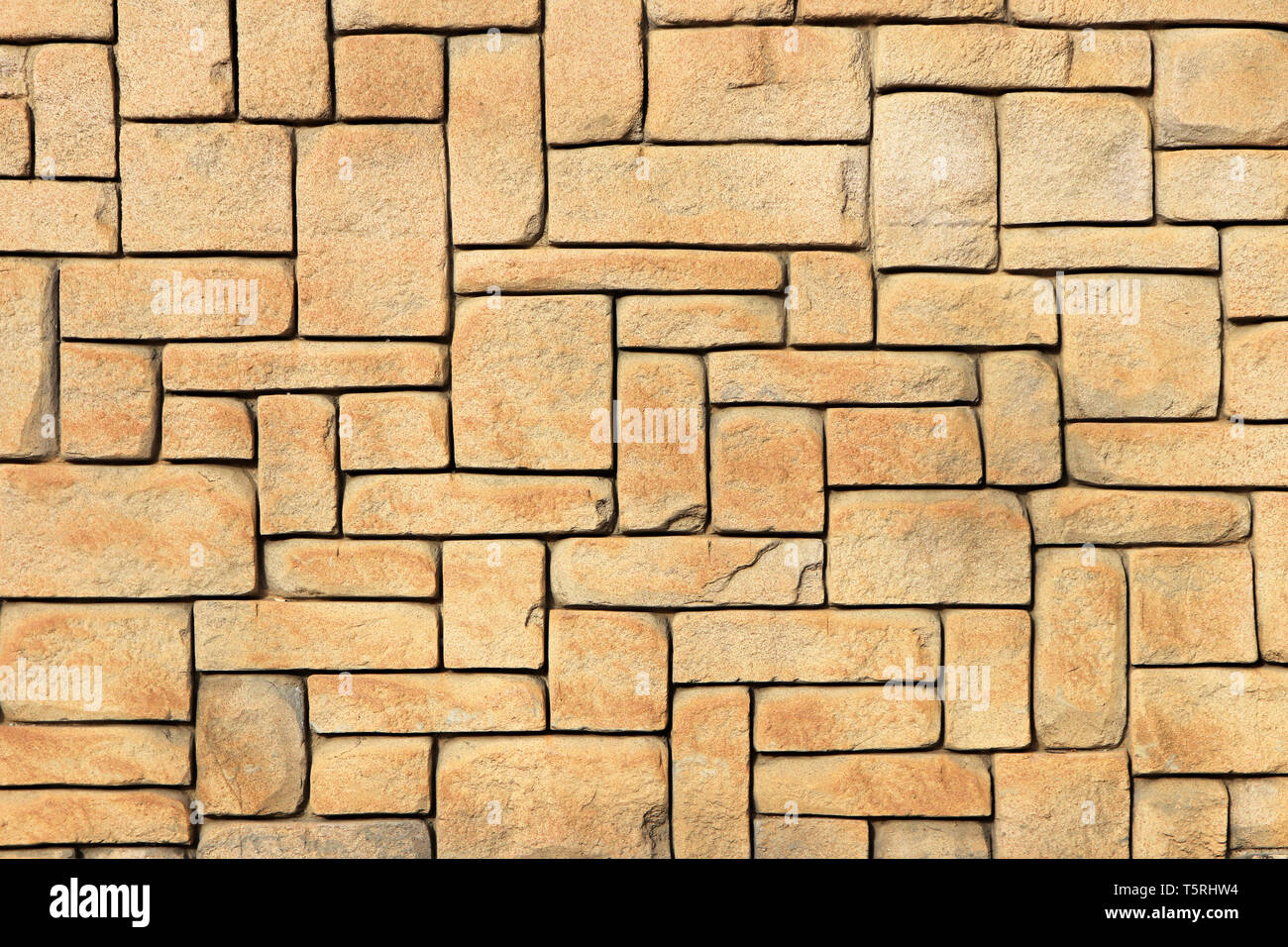 Masonry stone cladding wall texture. Geometric shapes surface ...