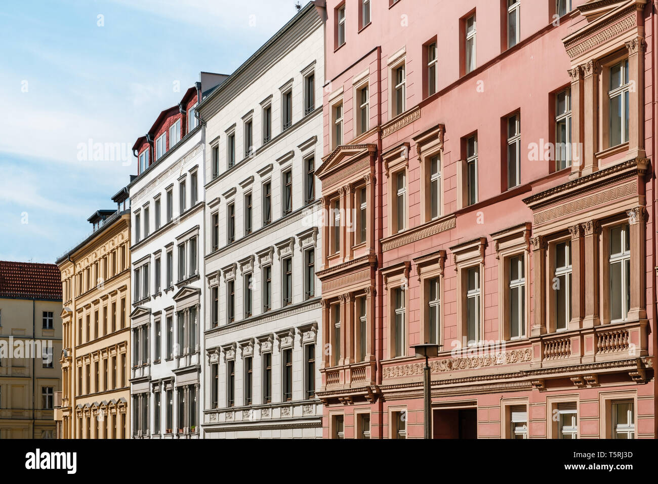street view of old , renovated buildings, colorful house facade ...