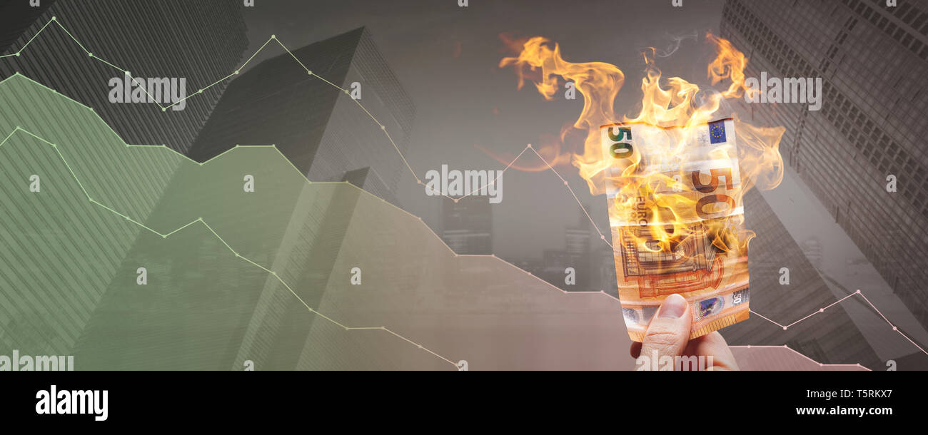 Depreciation concept – burning 50€ bill in front of a declining graph ...
