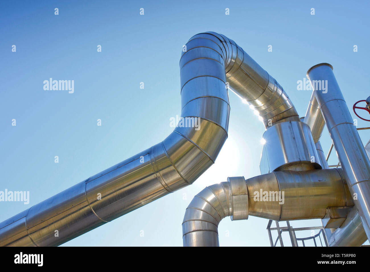 Geothermal power pipe structure against a blue background Stock Photo ...