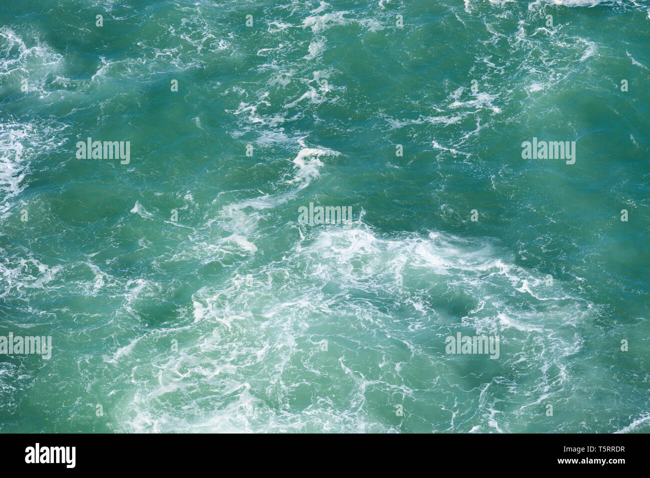 Wavy emerald ocean surface from above Stock Photo - Alamy