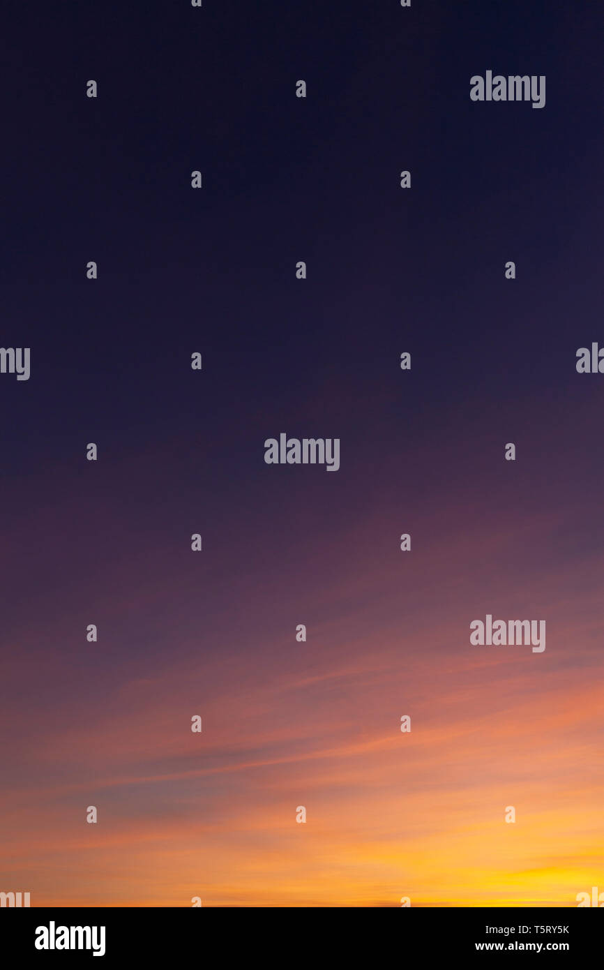 Sunset sky and wispy clouds. Orange and yellow light on clouds Stock ...