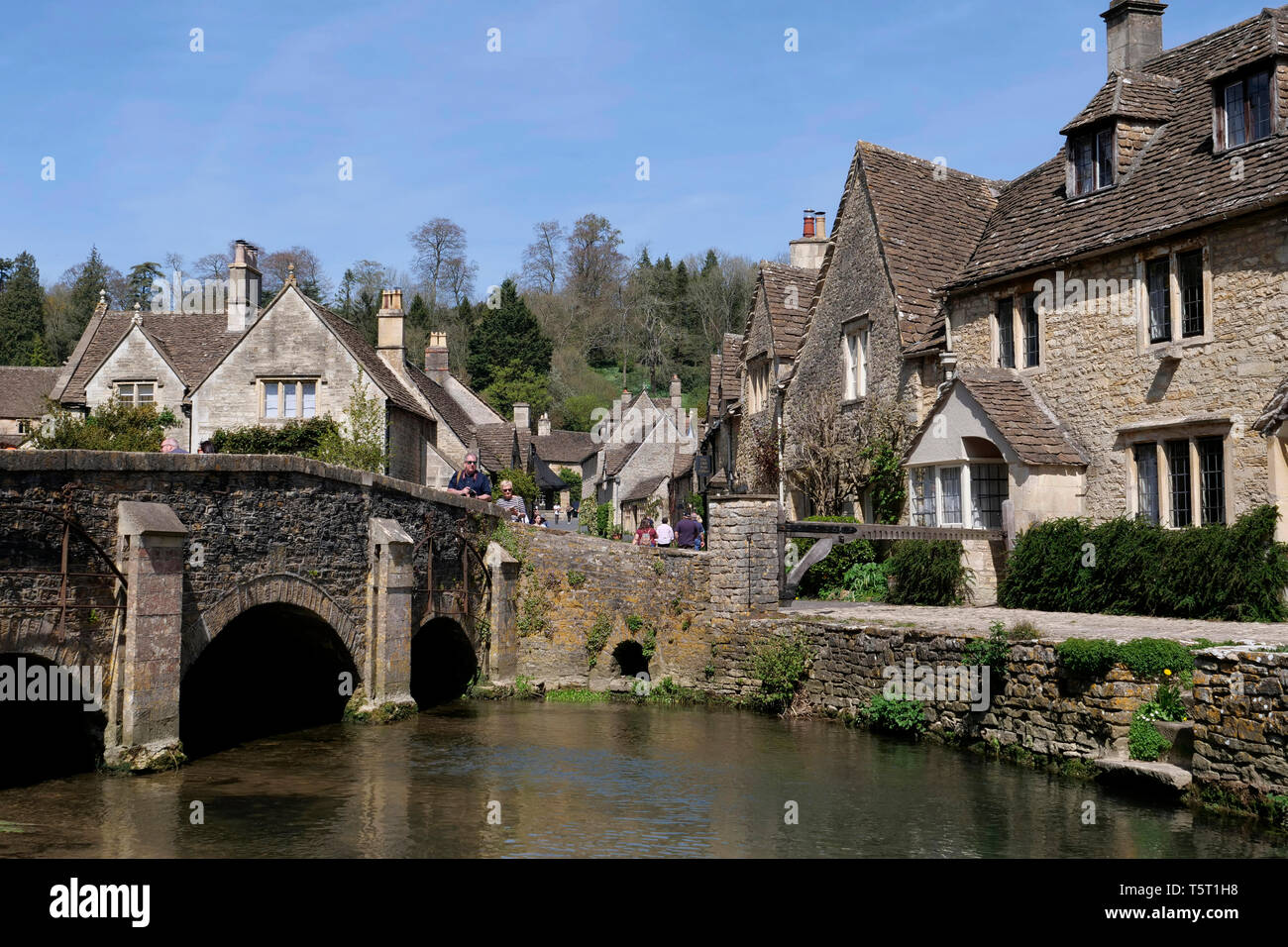 View of the river Bybrook and arched stone built bridge in Castle ...