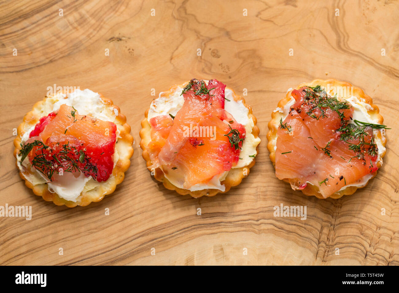 Slices of gravadlax from a fillet of rainbow trout, Oncorhynchus mykiss ...