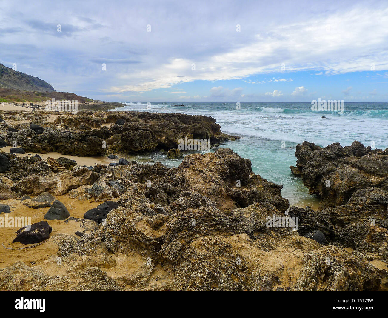 Coastline at the west side of Oahu, Hawaii with large rocks at the ...