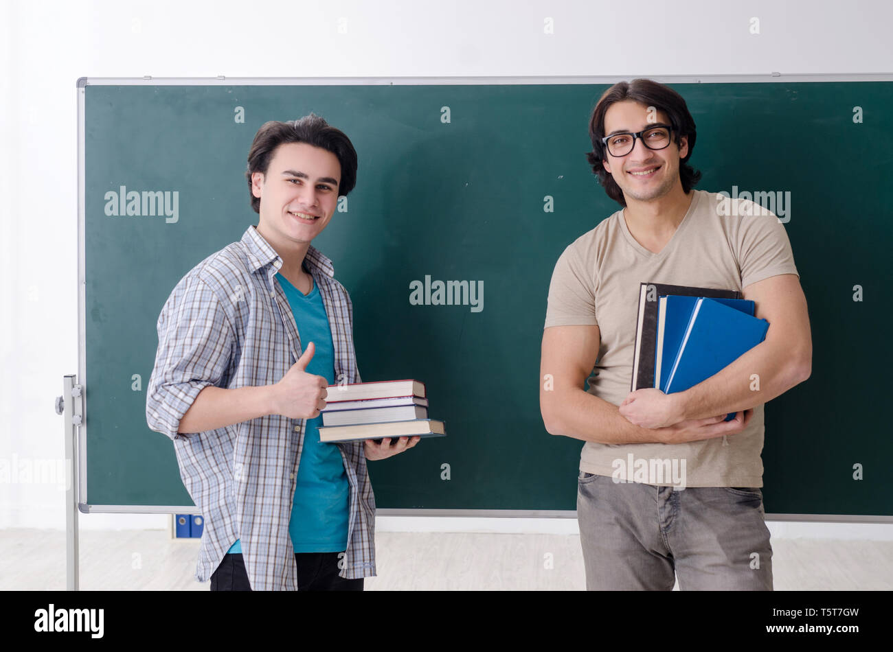 Two male students in the classroom Stock Photo - Alamy