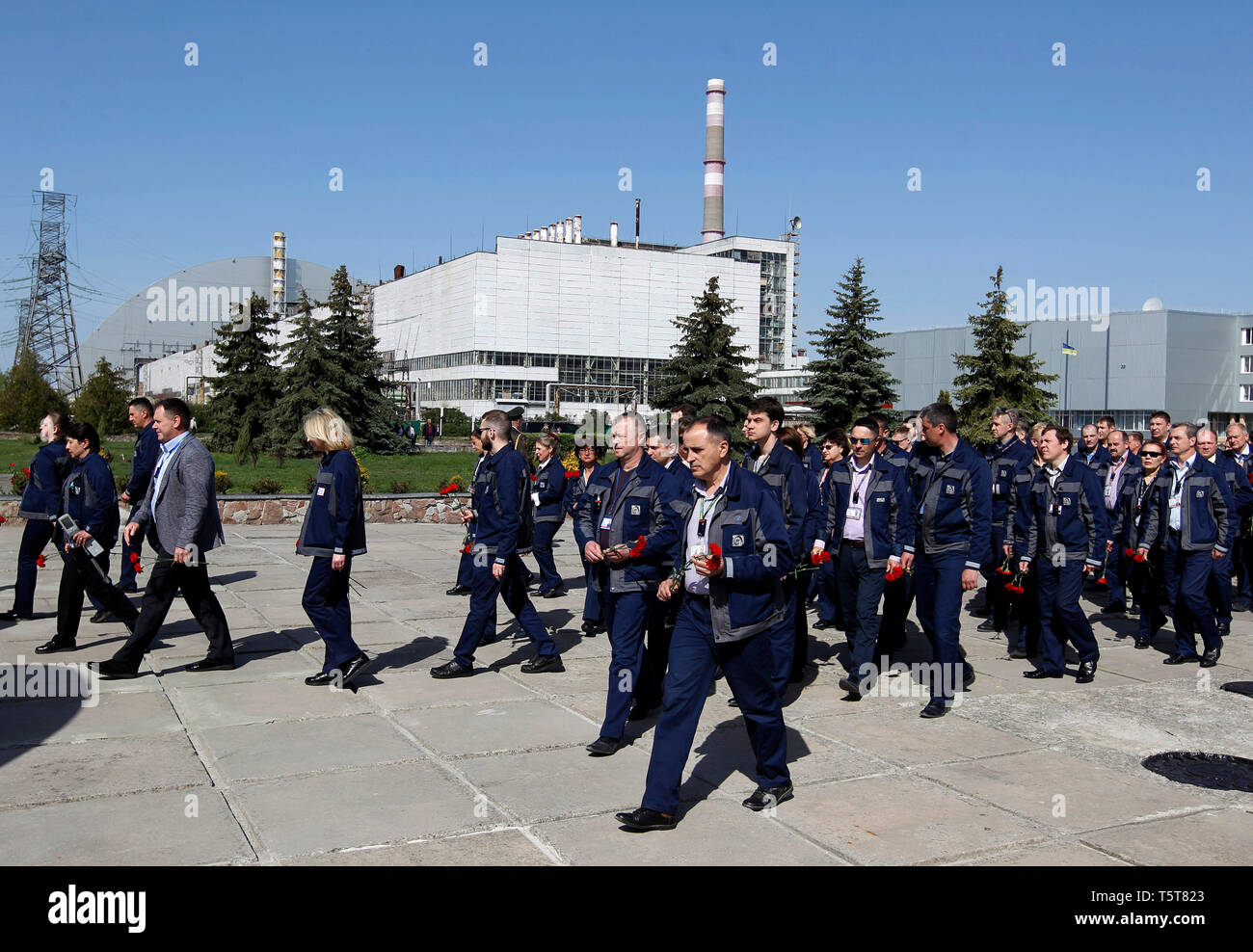 Workers are seen with flowers during the anniversary. Ukrainians marked ...