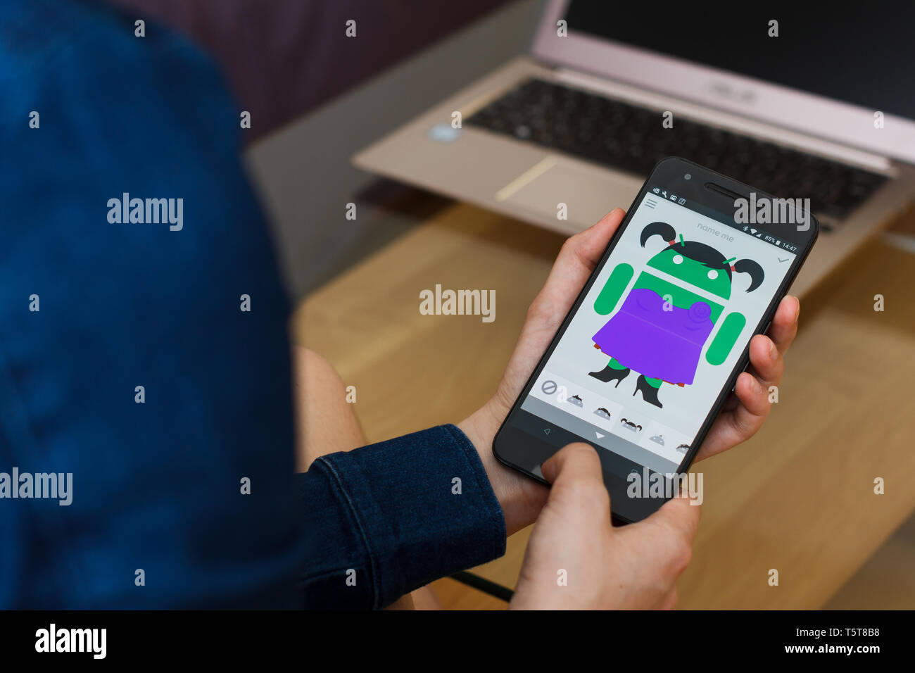 SAN FRANCISCO, US - 22 April 2019: Close up to female hands holding smartphone using Google ...